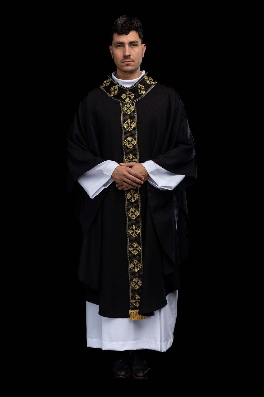 Black liturgical chasuble with an embroidered orphrey and a cross-patt