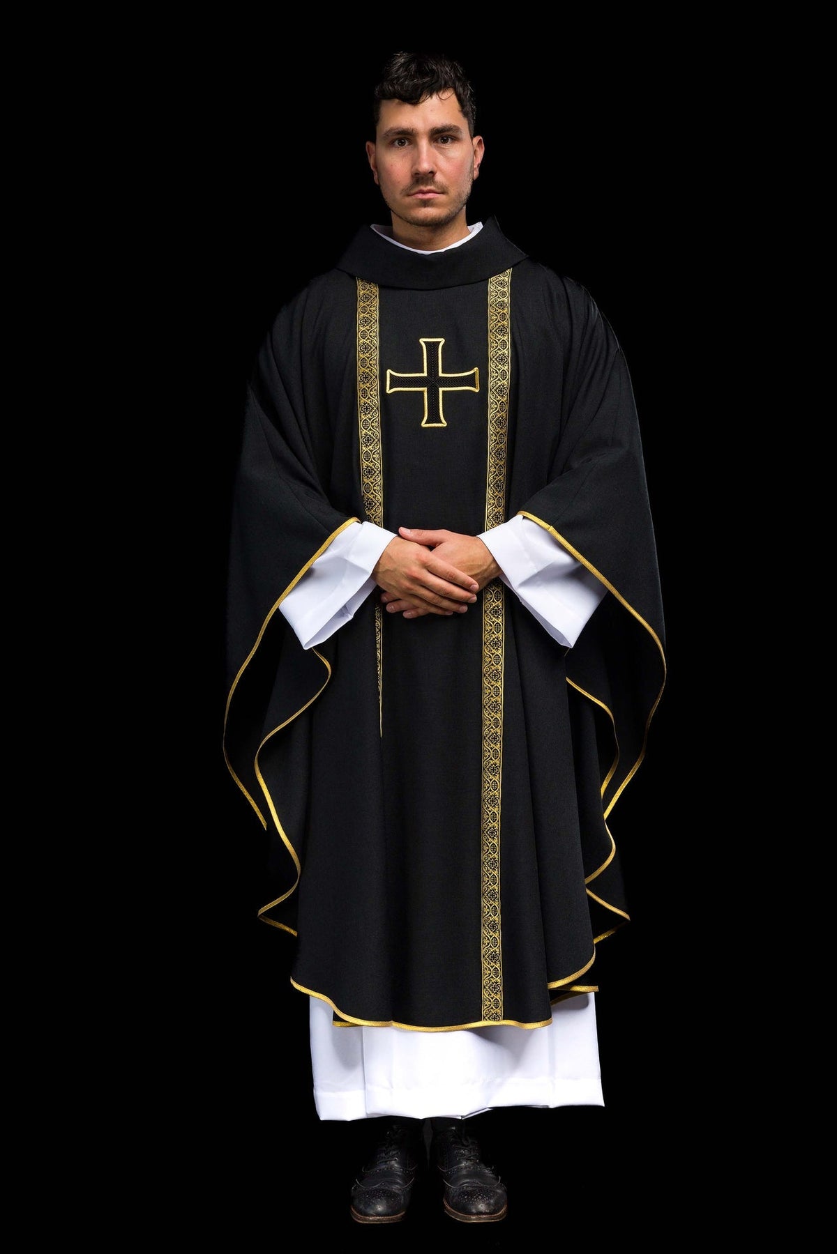 Black liturgical chasuble with embroidered cross and jacquard bands